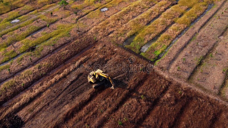 Excavator Dig Ground at Construction Site. Aerial View of a Wheel ...