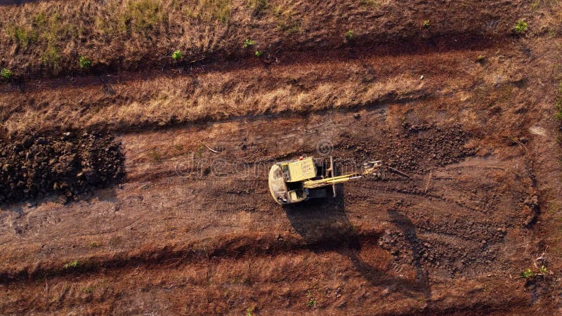 Excavator Dig Ground at Construction Site. Aerial View of a Wheel ...