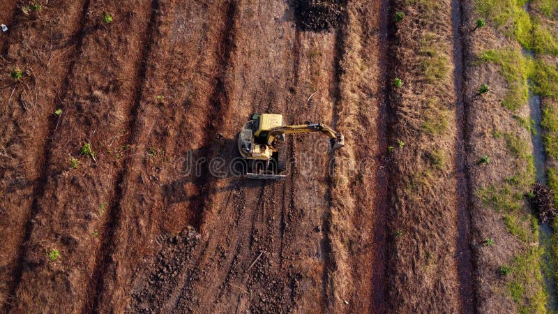 Excavator Dig Ground at Construction Site. Aerial View of a Wheel ...