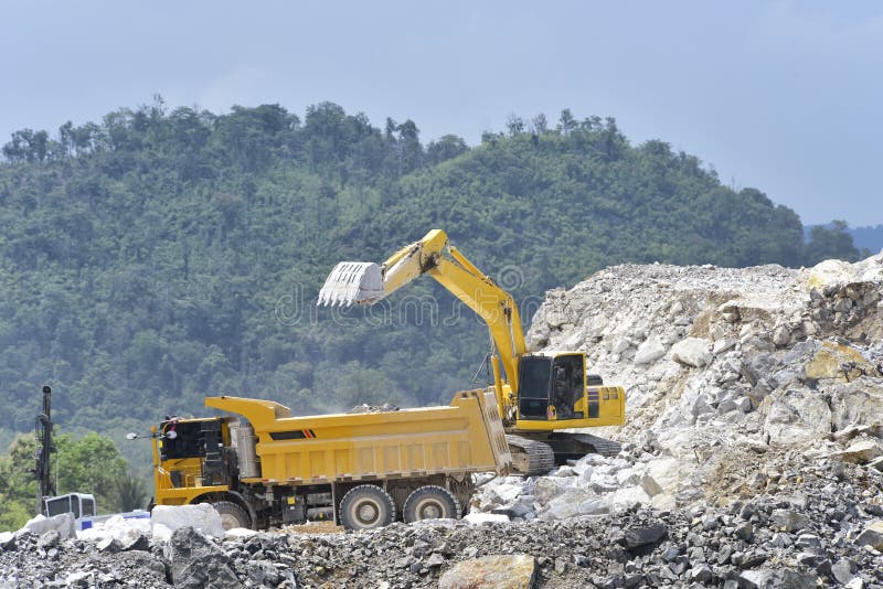 Excavator Dig Ground at Construction Site. Earthmover on Road ...