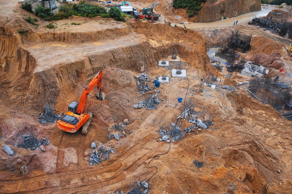 Excavator Dig the Ground in Foundation Pit of a Building on a ...