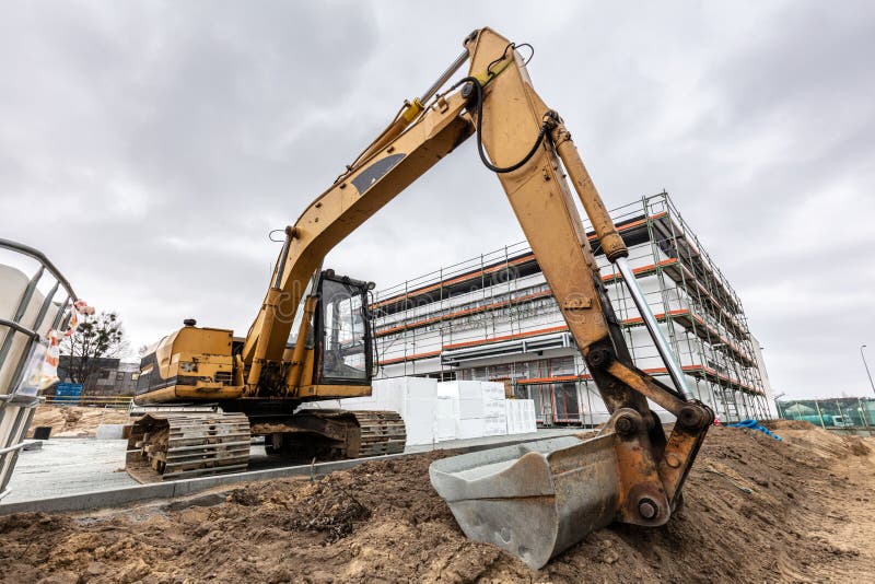 Excavator or Digger Working on Office and Warehouse Building ...