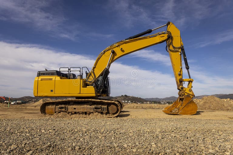 An Excavator with Digging Bucket Against a Blue Sky Stock Image - Image ...