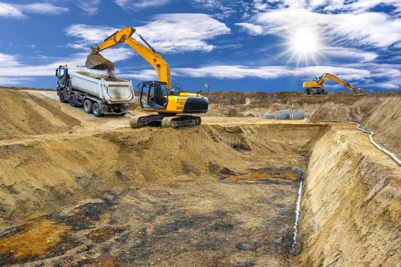 Excavator is Digging at Construction Site Stock Image - Image of ...