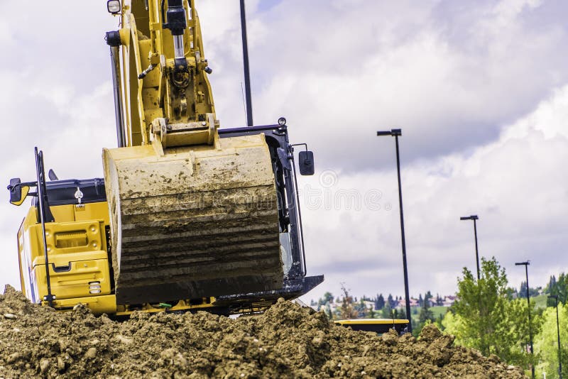 Excavator Digging at Contruction Site for a New Building Stock Photo ...