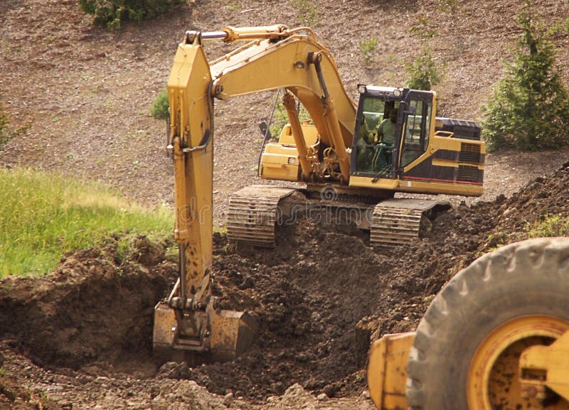 Excavator Digging Dirt stock photo. Image of bucket, excavator - 5647988