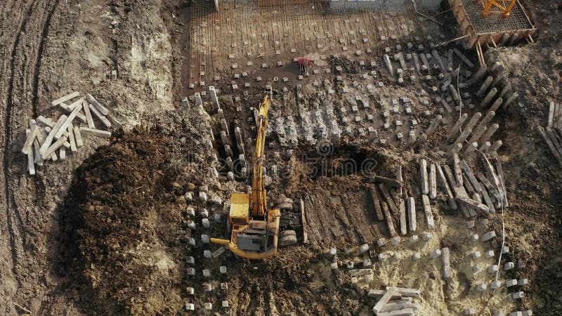 The Excavator is Digging the Foundation of the House. Piles and ...