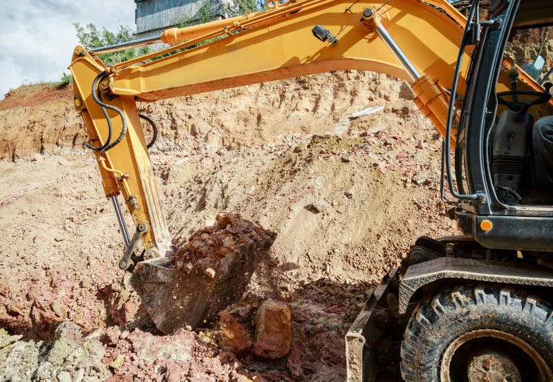 Excavator Digging a Hole. Earthwork Stock Image - Image of yellow ...