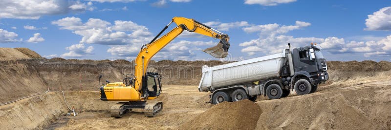 Excavator is Digging and Loading at Construction Site Stock Image ...