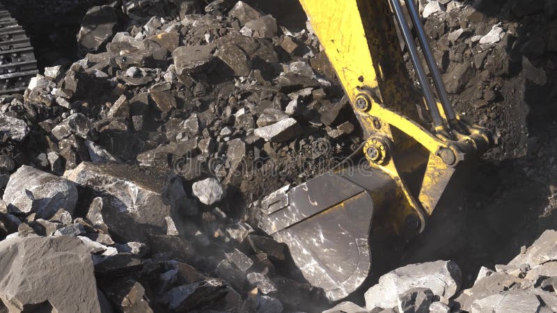 Excavator Digging Ore Close-up. Bucket Excavator Rakes Rock. Open Pit ...
