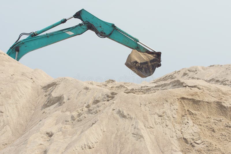 Excavator is digging sand stock image. Image of loader - 116681513