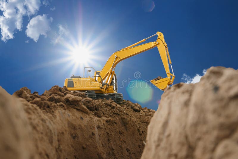 Excavator Digging the Soil in the Construction Site. Stock Photo ...