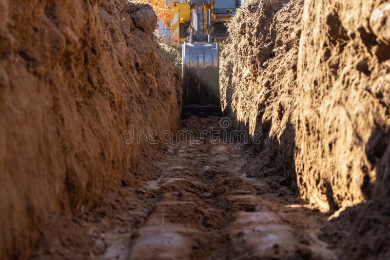Excavator Digging a Deep Trench Stock Image - Image of machine ...