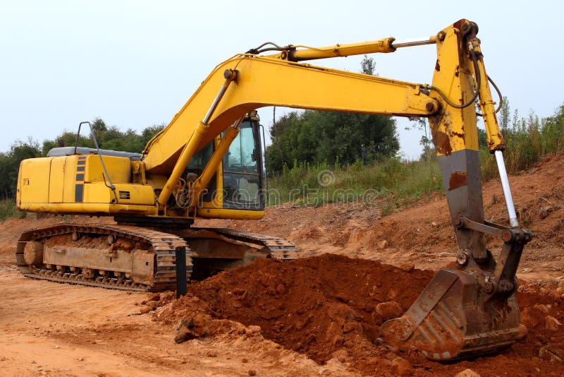 Excavator Digging Up Some Ground And Rocks #2 Stock Photo - Image of ...