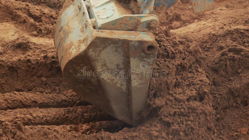 The Excavator Digs a Hole with a Telescopic Rotary Bucket. Pipeline ...