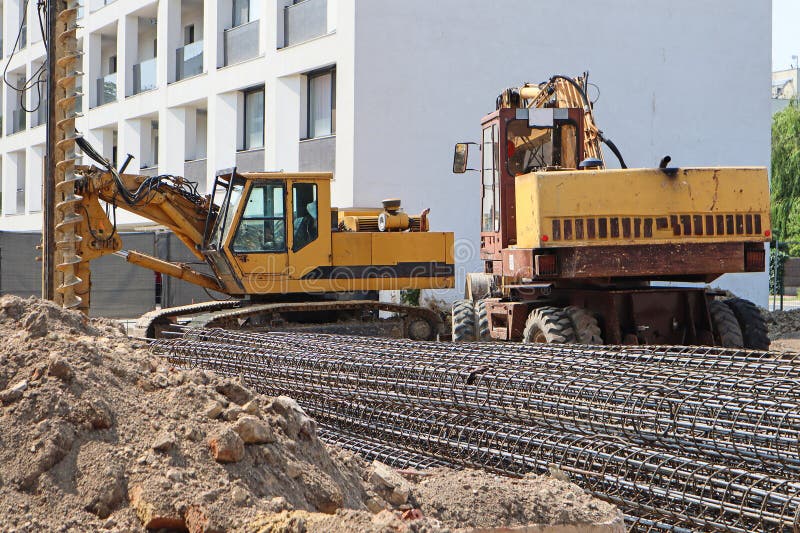 Excavator and Drill Machineries at the Construction Site Editorial ...