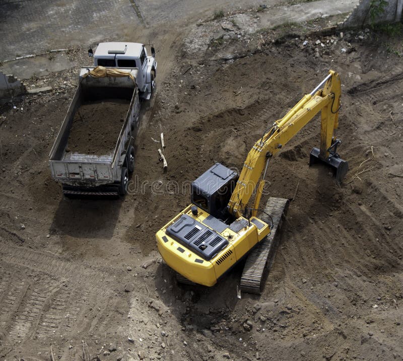 Excavator and Dump Truck stock photo. Image of professions - 16458822