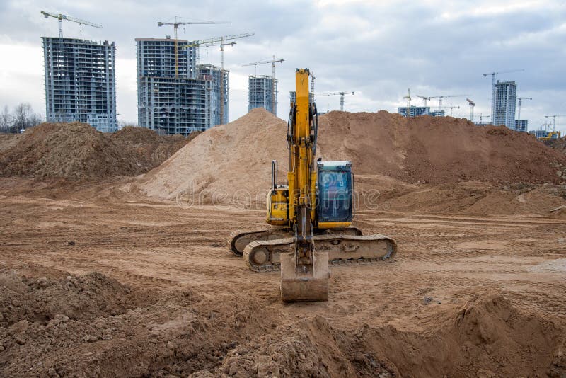 Excavator during Earthmoving at Construction Site. Backhoe Dig Ground ...