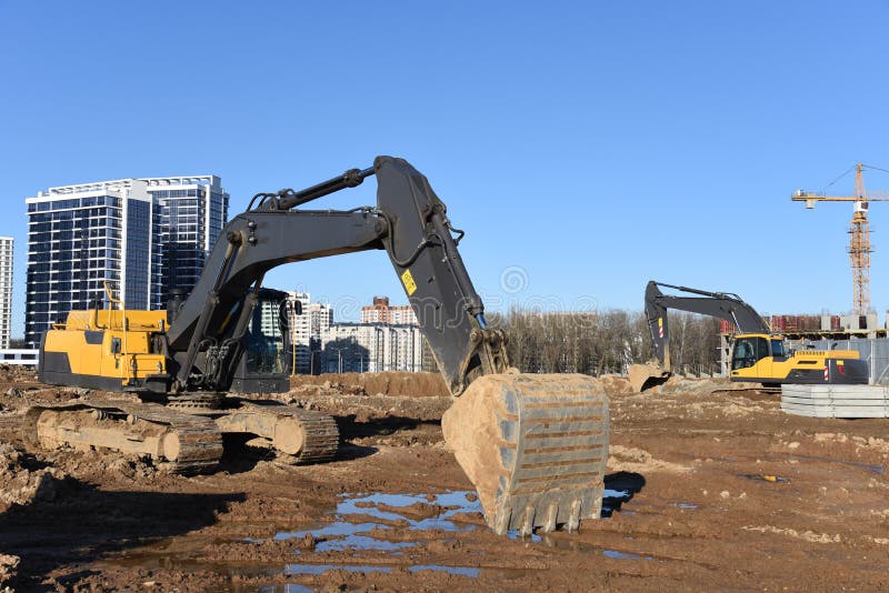 Excavator during Earthmoving at Construction Site. Backhoe Dig Ground ...