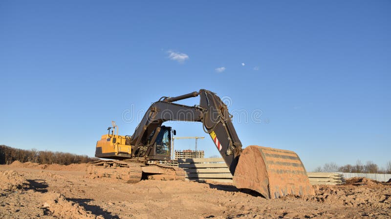 Excavator on Earthworks at Construction Site. Backhoe on Foundation ...