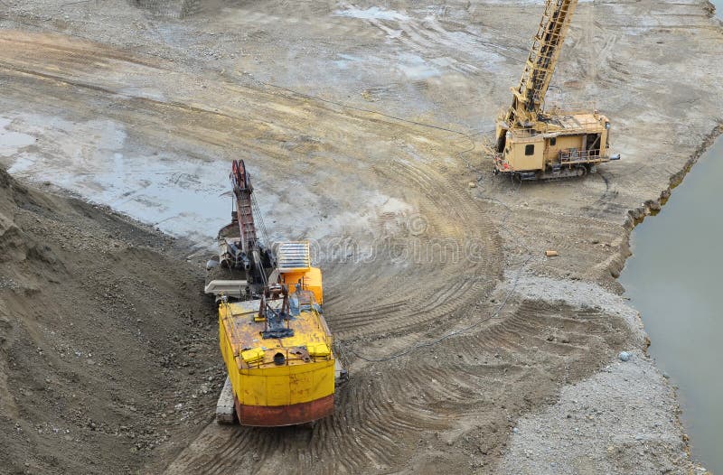 Excavator with Electric Shovel Loading the Rocks in Mining Truck at ...