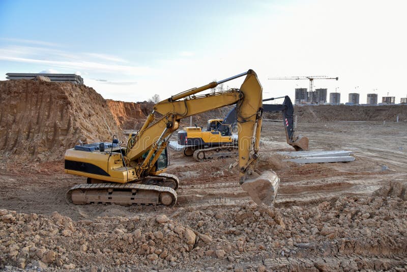 Excavator during Excavation at Construction Site. Backhoe on Foundation ...