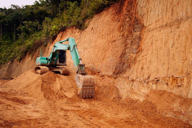 Digging the Pit Foundation a Hole with Excavator. Earthwork in ...