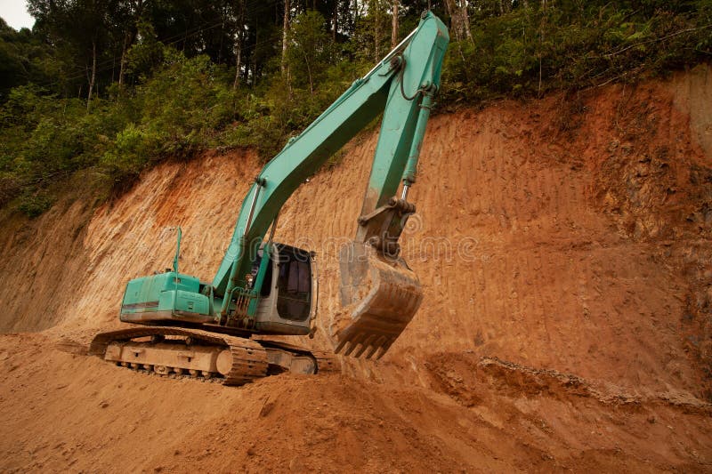 Digging the Pit Foundation a Hole with Excavator. Earthwork in ...