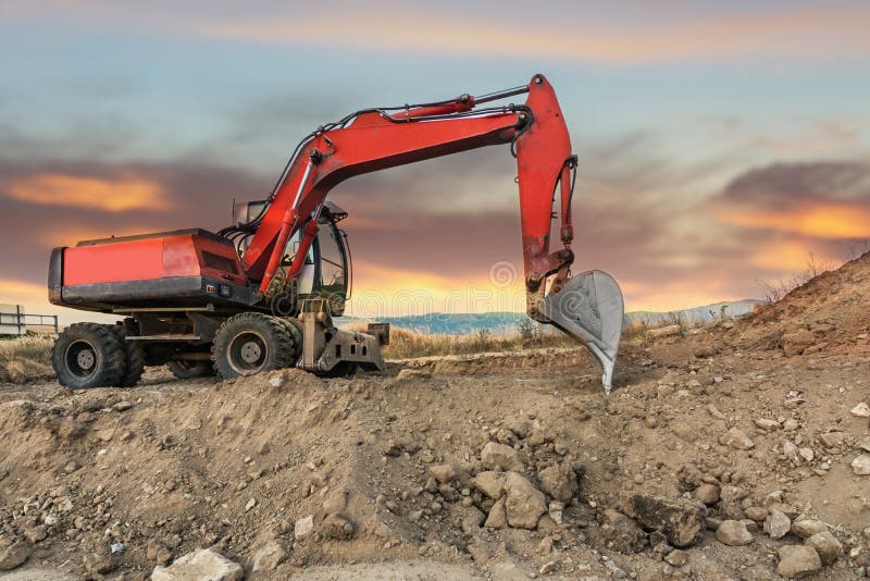 An Excavator Extracting Dirt in a Construction Site Stock Photo - Image ...