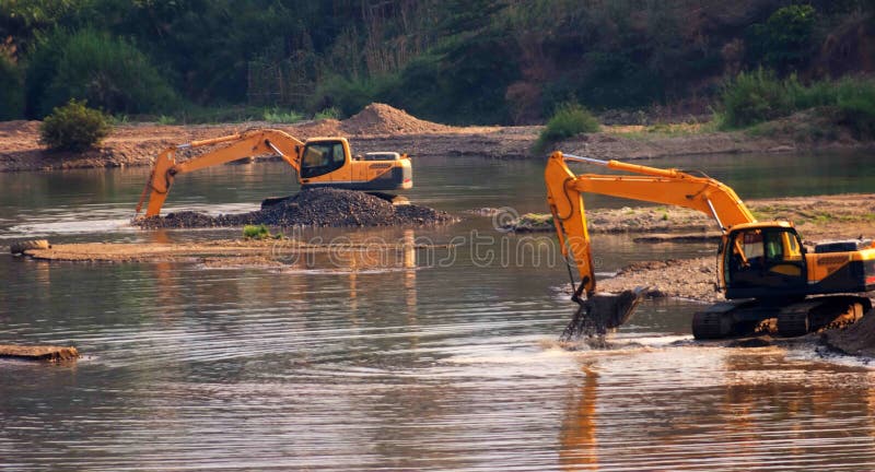 Excavator Extracts Sand and Pebbles from a River Stock Image - Image of ...