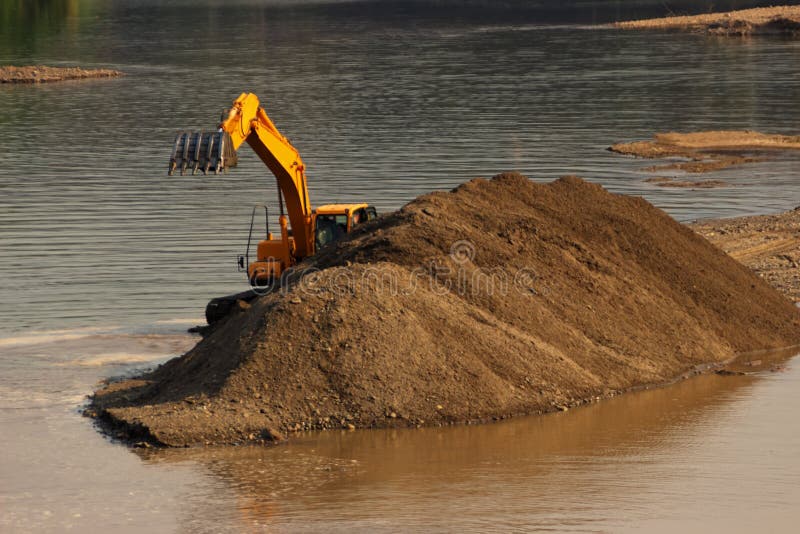 Excavator Extracts Sand and Pebbles from a River Stock Photo - Image of ...