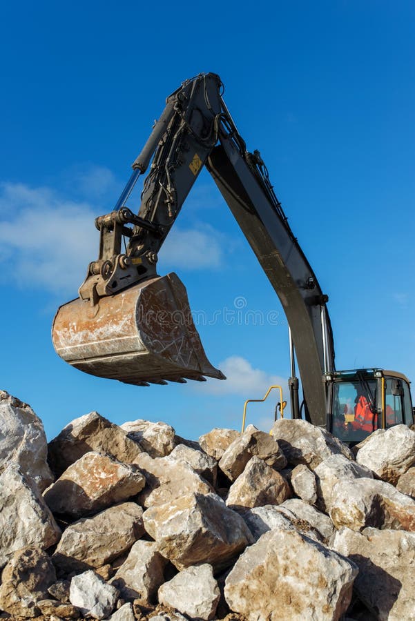 Backhoe in Action on a Construction Site Close Up Stock Photo - Image ...