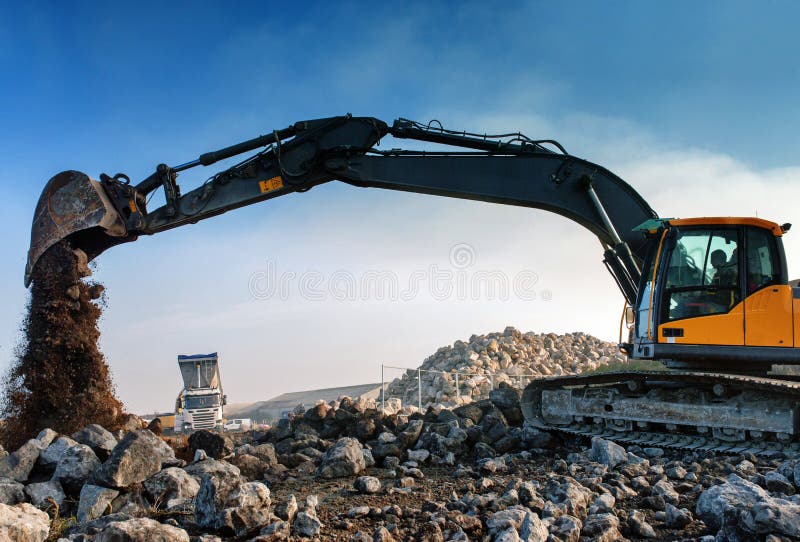 Backhoe in Action on a Construction Site Close Up Stock Image - Image ...