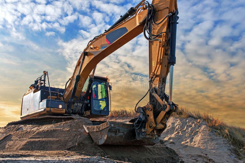 Backhoe in Action on a Construction Site Close Up at Dawn Stock Image ...