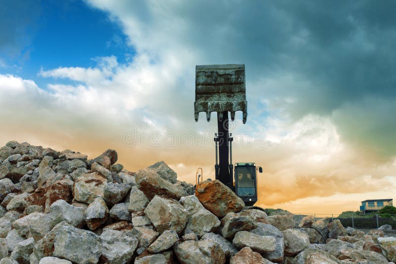 Backhoe in Action on a Construction Site Close Up at Dawn Stock Image ...