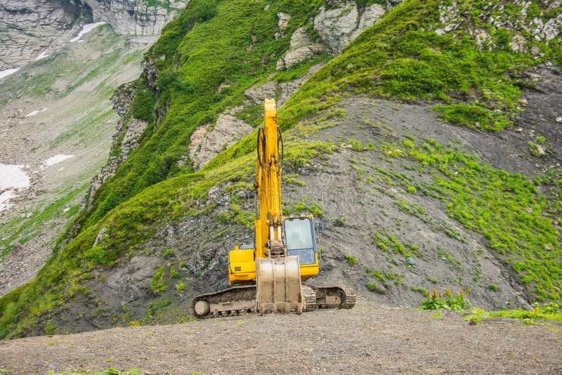 Excavator Heavy Equipment in Mountains on Steep Range Slopes Stock ...