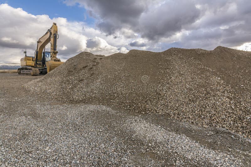 Excavator and Heavy Machinery for Processing Rock and Stone in a Quarry ...