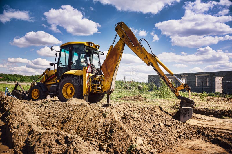 Excavator at House Construction Site - Digging Foundations for Modern ...