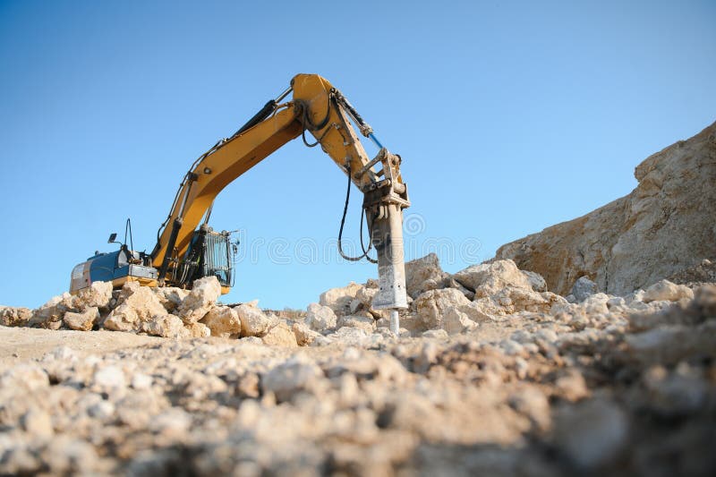 Excavator with Hydraulic Hammer on Road Construction Works Stock Photo ...