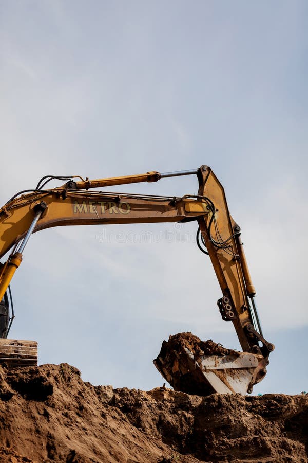 Excavator JCB working editorial photo. Image of project - 297402371