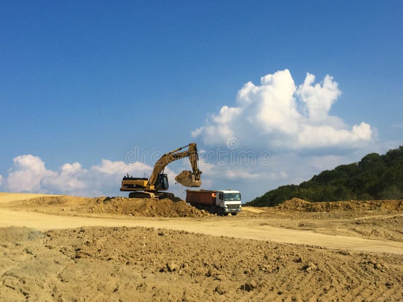 Excavator Leveling the Ground Stock Photo - Image of construction ...