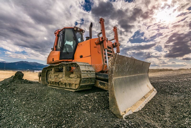Excavator is Leveling Gravel on the Road Stock Photo - Image of ...