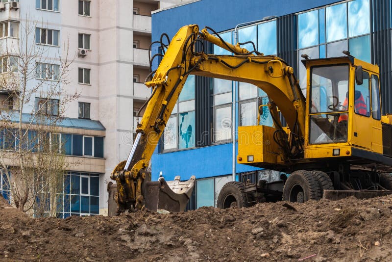 Excavator Loader and Dump Truck during Earthworks at a Construction ...