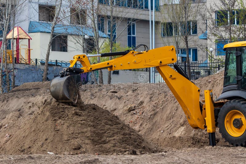 Excavator Loader during Earthworks at a Construction Site. Stock Photo ...
