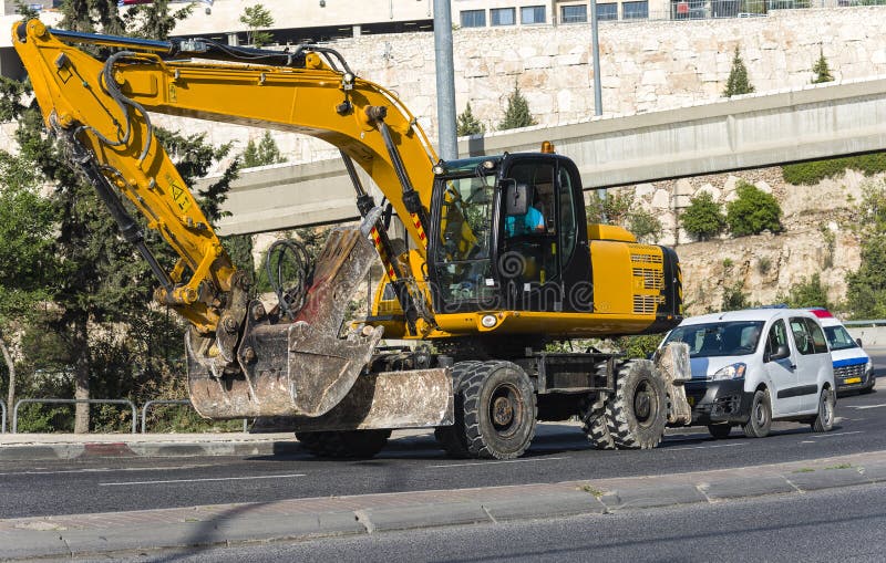 Many Excavators of Different Colors and Sizes Lined Up at the ...