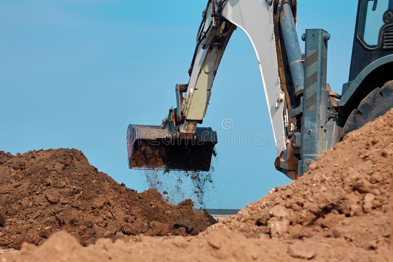 Excavator Loader Working at Ground Area, Digging Process. Yellow Bucket ...
