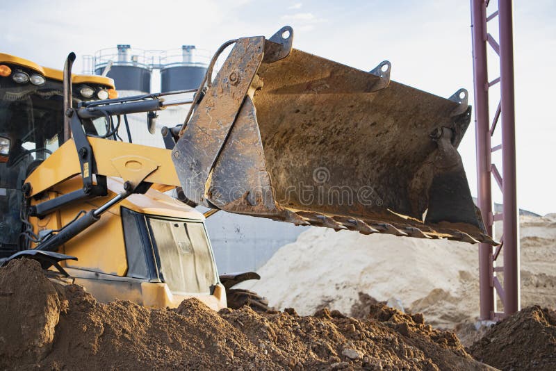 The Excavator Loader Works with a Bucket for Transporting Sand at a ...
