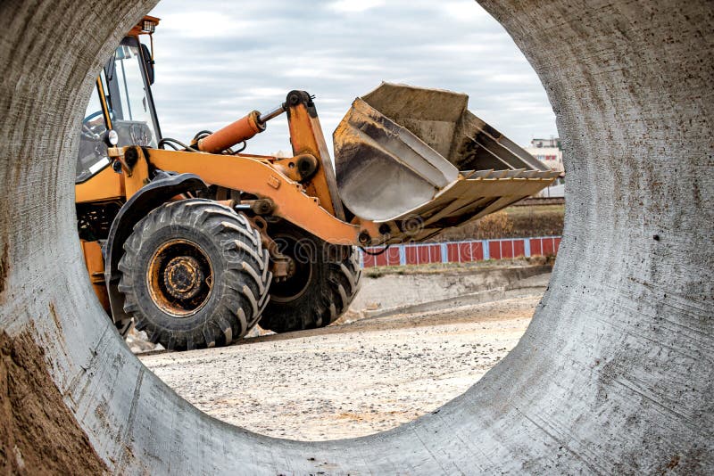 The Excavator Loader Works with a Bucket for Transporting Sand at a ...