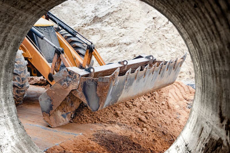 The Excavator Loader Works with a Bucket for Transporting Sand at a ...