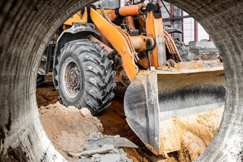 The Excavator Loader Works with a Bucket for Transporting Sand at a ...
